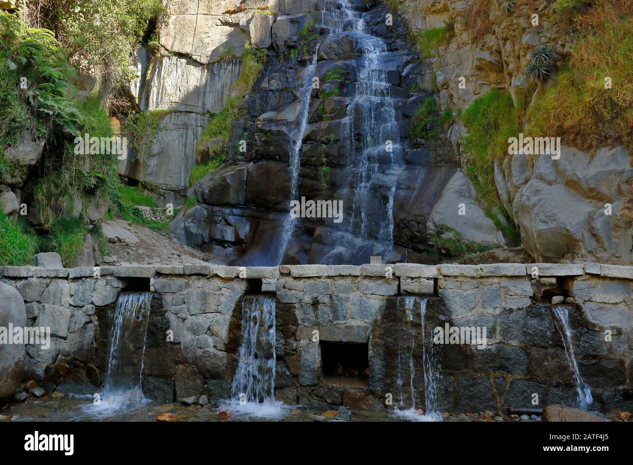 Beautiful sunset view of the Huanano waterfall in the San Jerónimo de ...