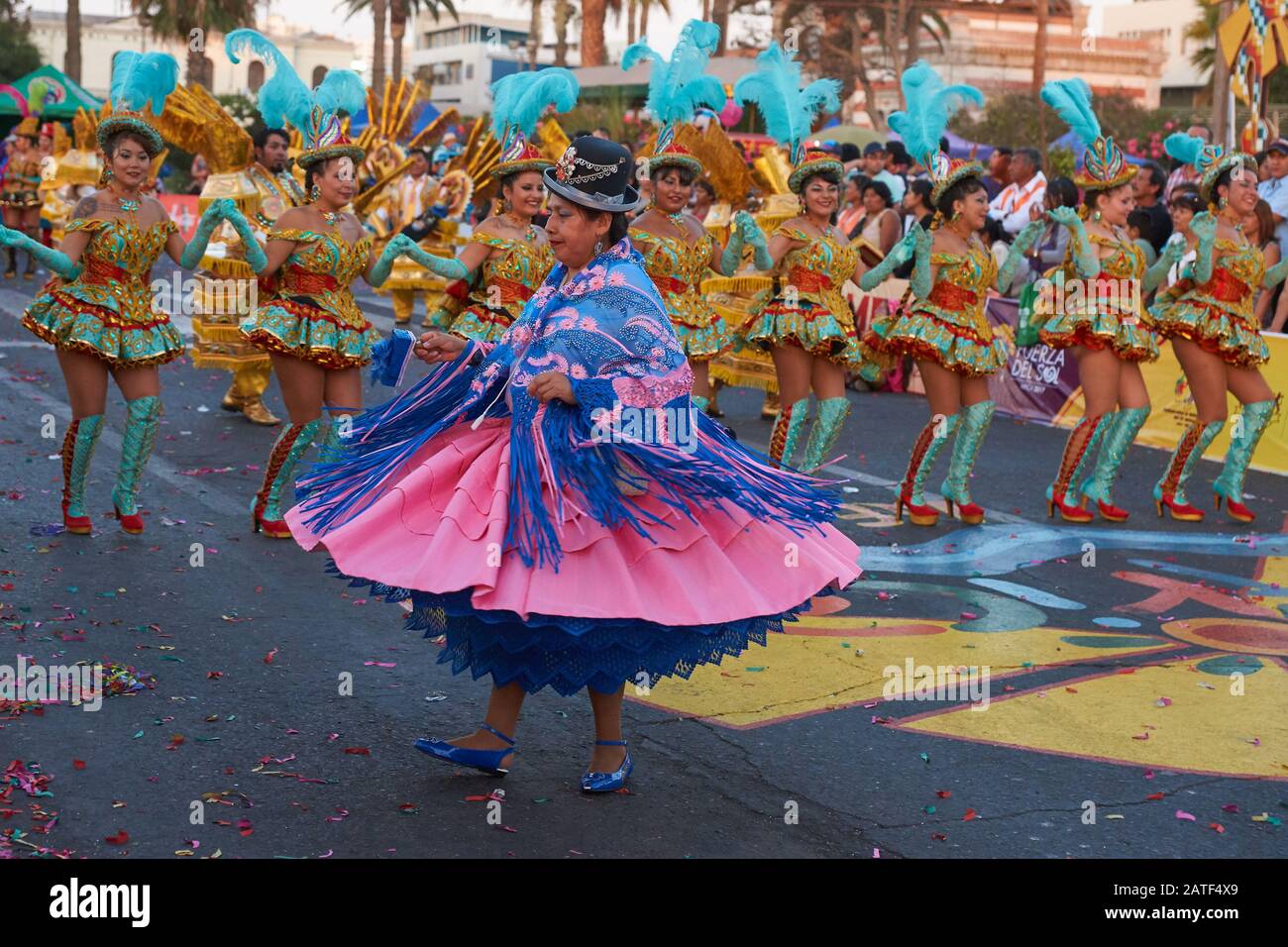 Female members of a Morenada dance group in ornate costumes performing ...