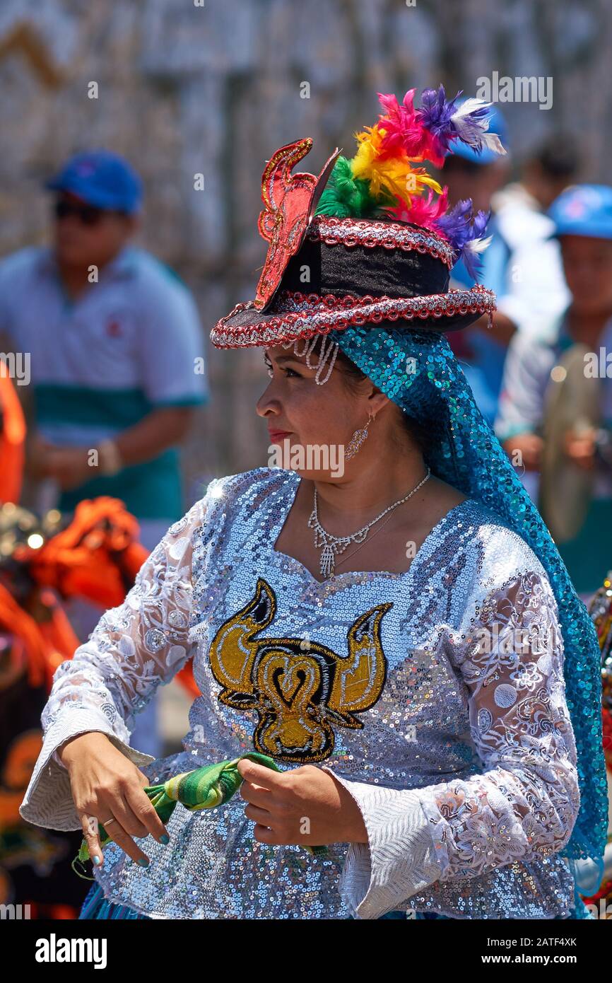 Members of a Waca Waca dance group in ornate costume performing at the ...