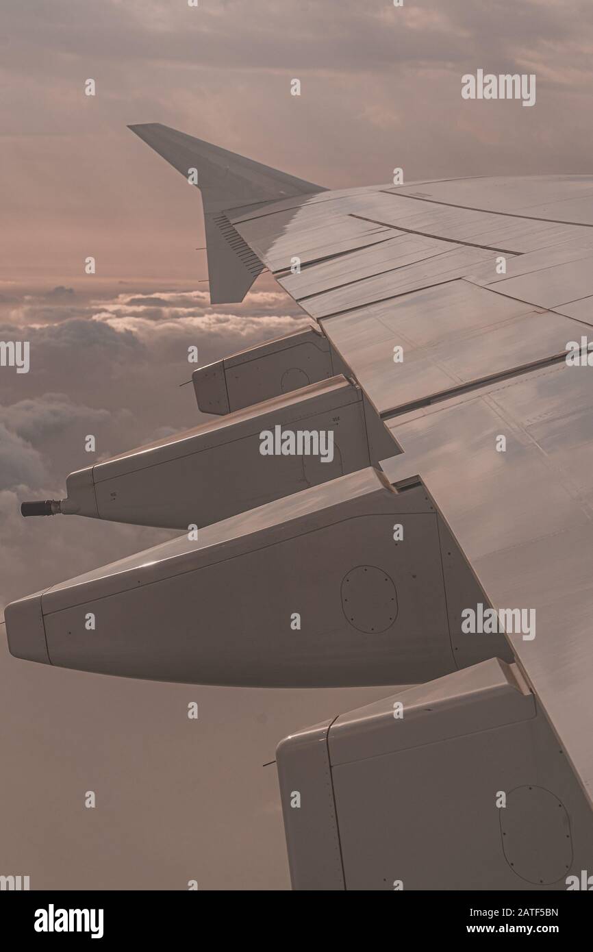 airplane wing through the airplane window Stock Photo - Alamy