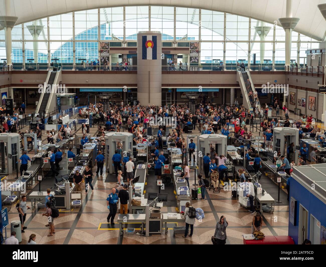 Large line of travelers backed up at security checkpoint at Denver ...