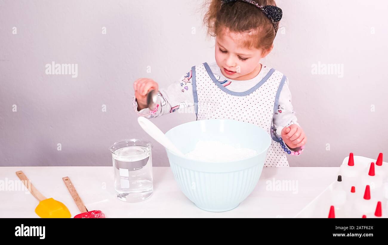 Step by step. Mixing royal icing to decorate sugar cookies Stock Photo ...