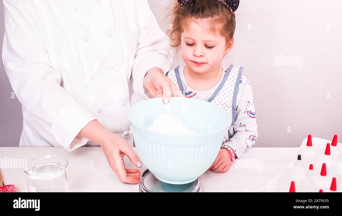 Step by step. Mixing royal icing to decorate sugar cookies Stock Photo ...