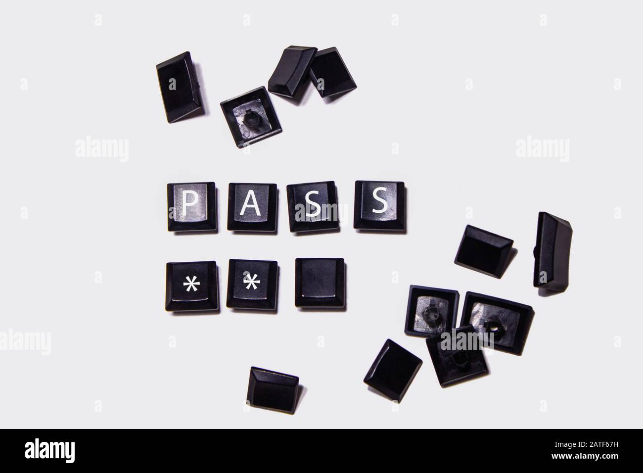 Pass word and asterisk symbols on black keys among the scattered ...