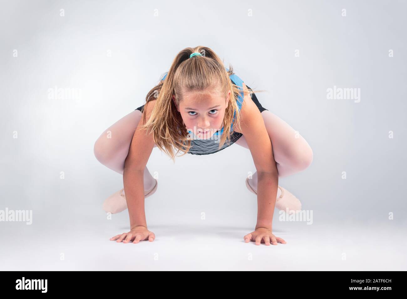 studio portrait shot of a young limber powerful girl in dance outfit ...