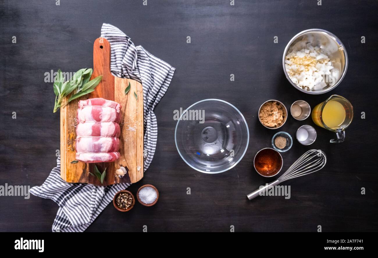 Flat lay. Undercooked boneless pork roast on the cutting board Stock ...