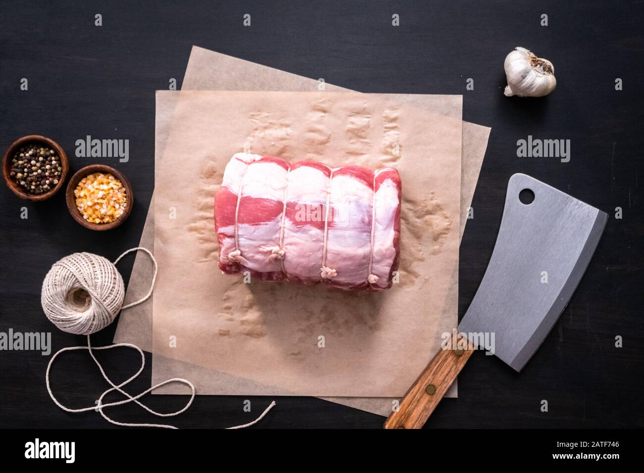 Flat lay. Uncooked boneless pork roast on the brown butcher paper Stock ...
