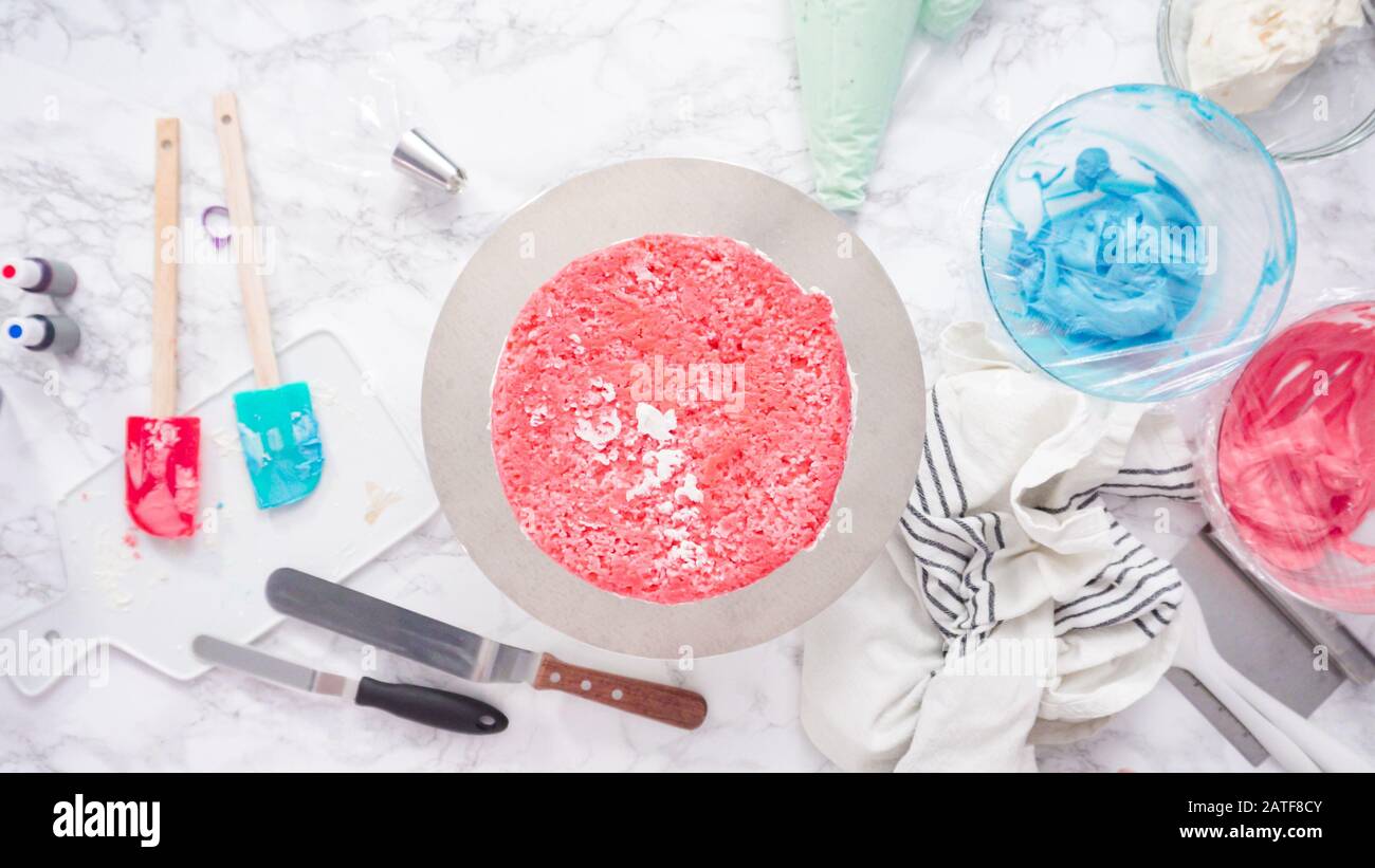 Stacking cake layers to create the round three-layer vanilla cake Stock ...