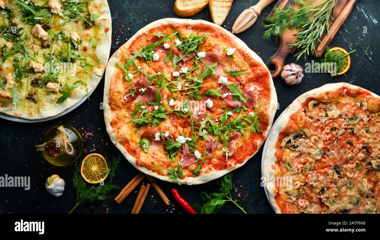 Pizza background. Assortment of pizza and ingredients. Italian ...