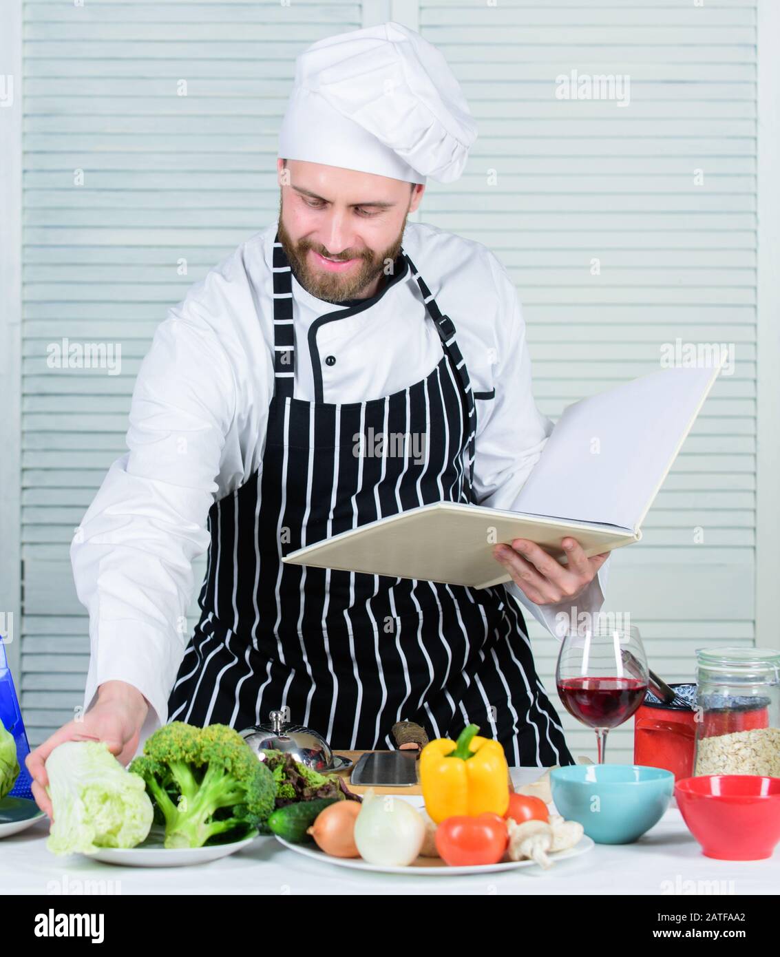 Culinary arts concept. Man learn recipe. Improve cooking skill. Book ...