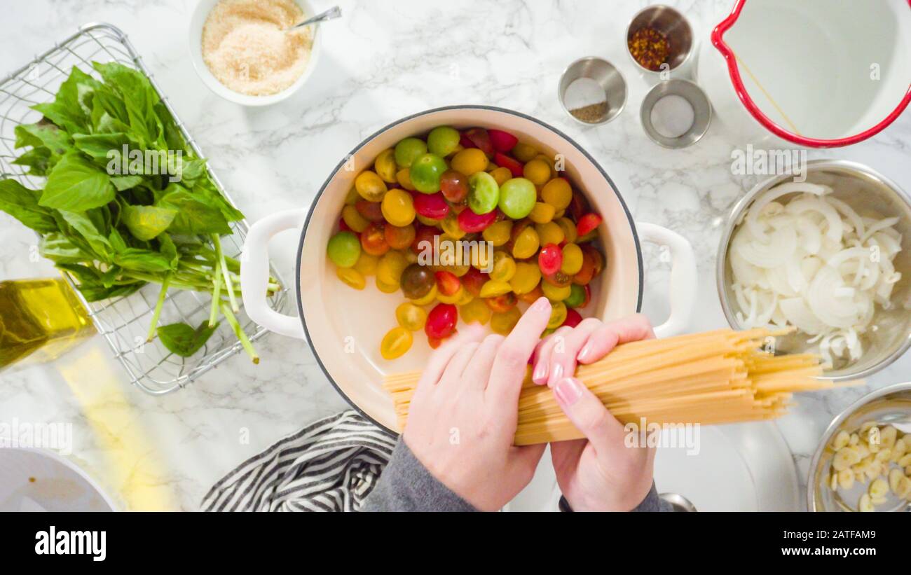 Flat lay. Step by step. Cooking on pot pasta recipe in an enameled cast ...