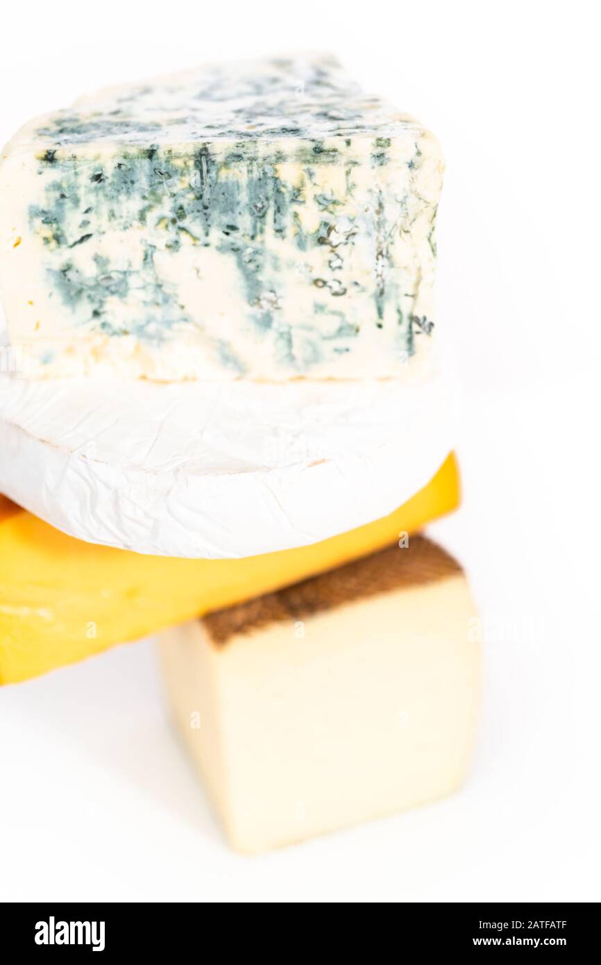 Variety of large wedges gourmet cheese on a white background Stock ...
