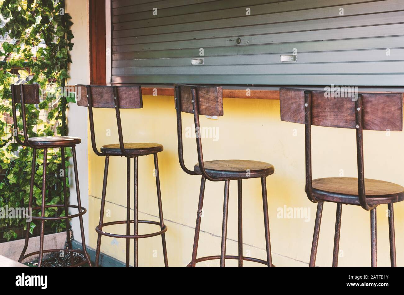 Empty bar - bar stools at the closed bar counter. Small business fail ... Empty bar - bar stools at the closed bar counter. Small business fail ...