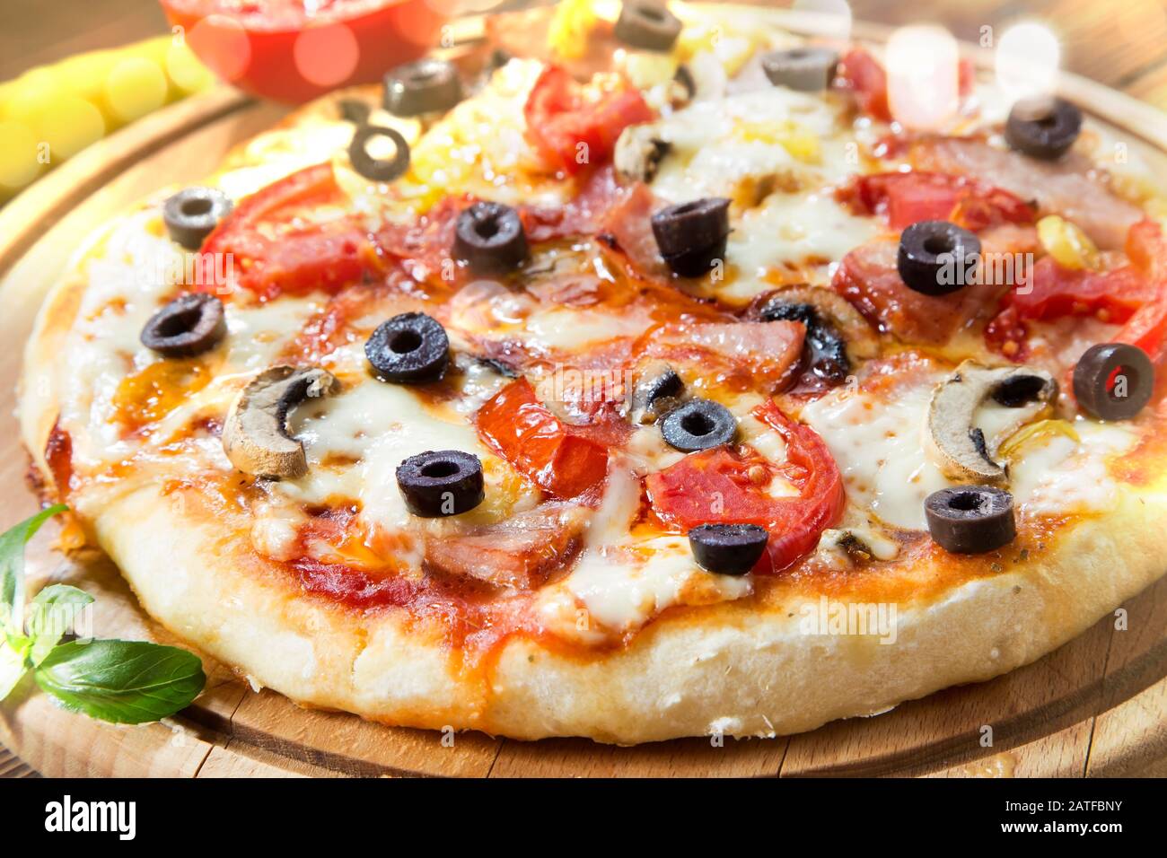 Homemade rustic pizza on wooden board Stock Photo - Alamy