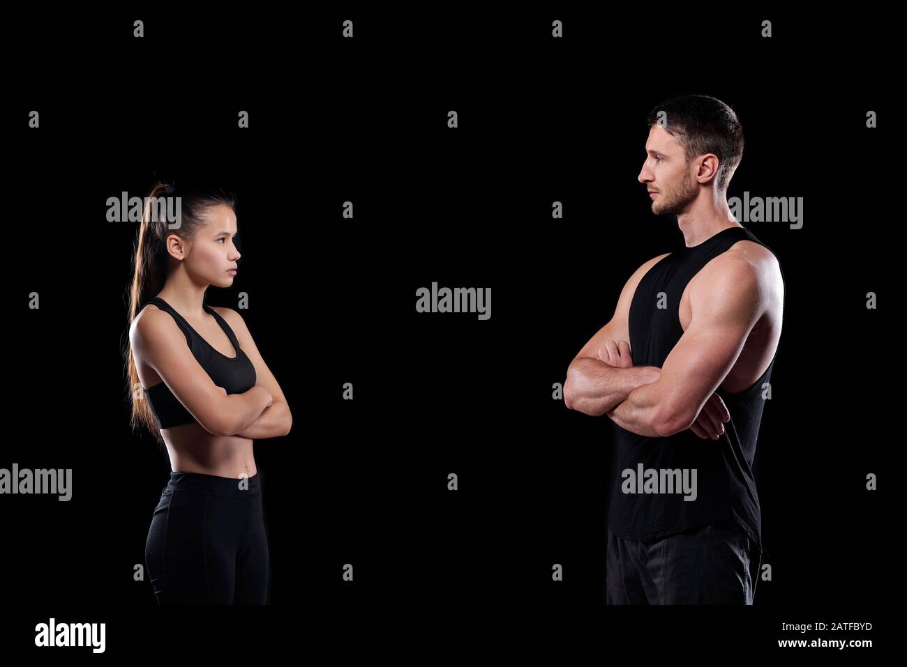 Two People Standing Next To Each Other