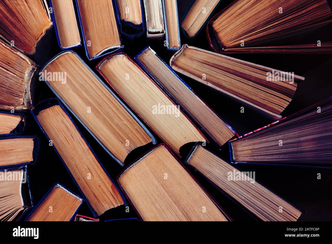 Old and well used hardback books or text books in a book shop or ...