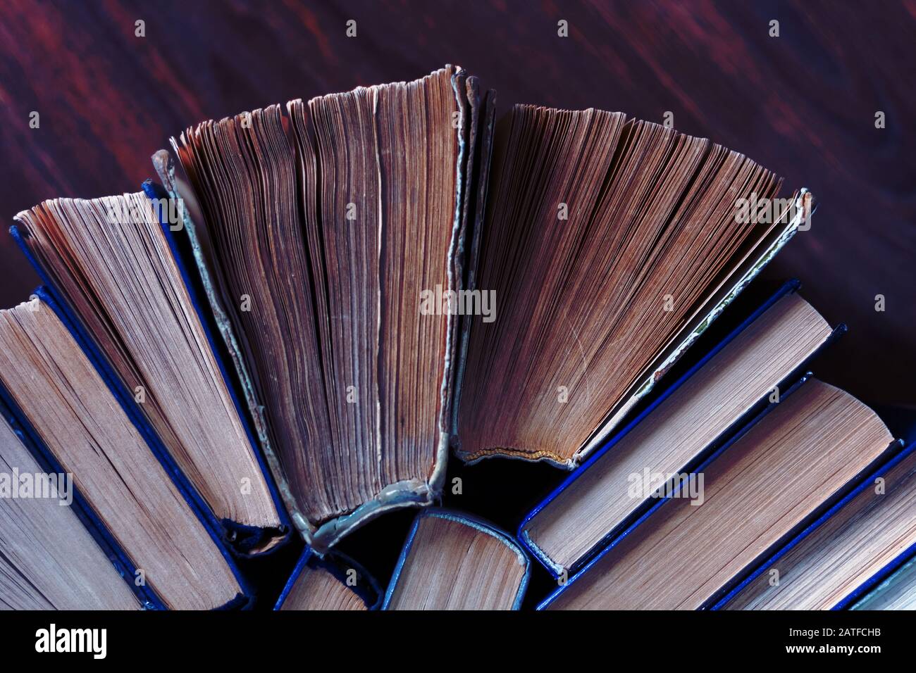 Old and well used hardback books or text books in a book shop or ...