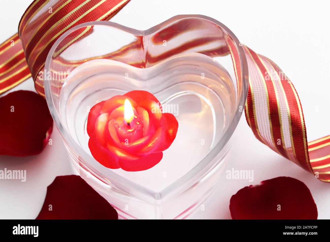 Composition with red candle and red ribbon on white background Stock ...