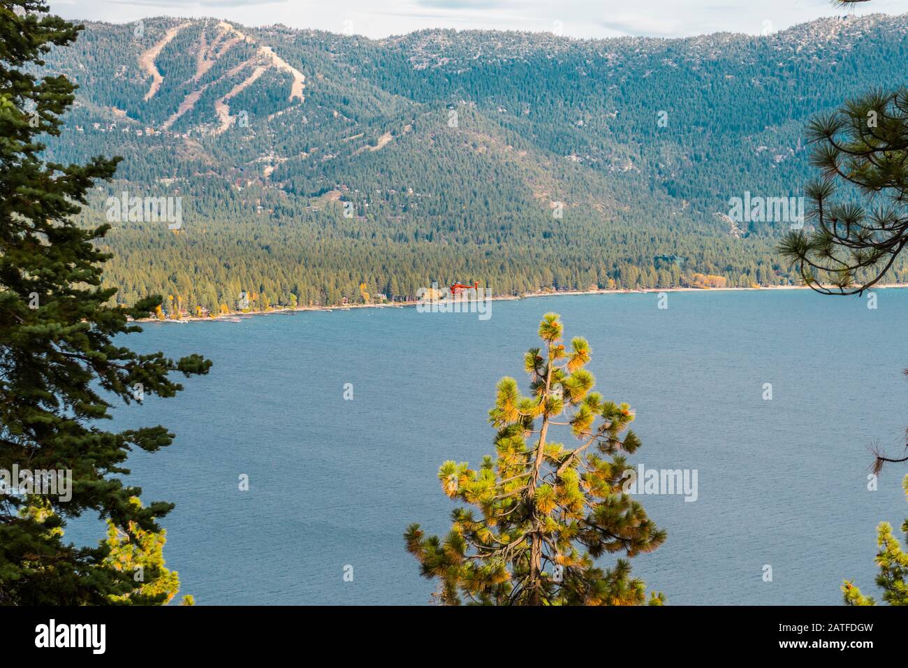 A red helicopter flies over Lake Tahoe near Crystal Bay Stock Photo - Alamy