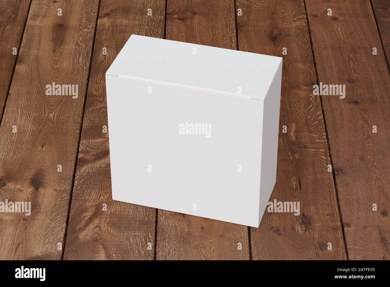 Blank white wide square box with closed hinged flap lid on dark wooden ...