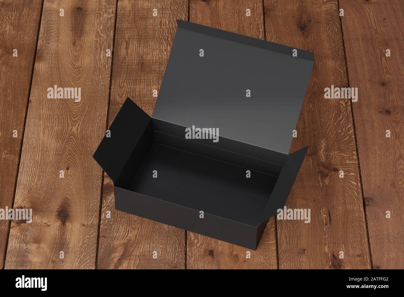 Blank black wide flat box with opened hinged flap lid on dark wooden ...
