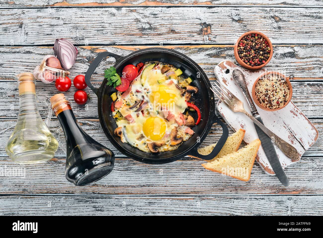 Traditional Israeli Cuisine dishes Shakshuka. Eggs with bacon and ...