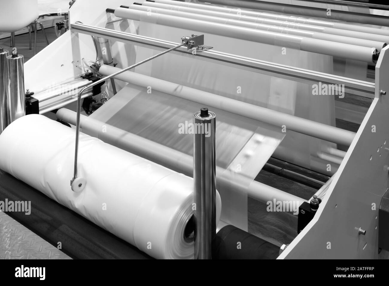 The operation of automatic plastic bag production machine. Close-up of ...