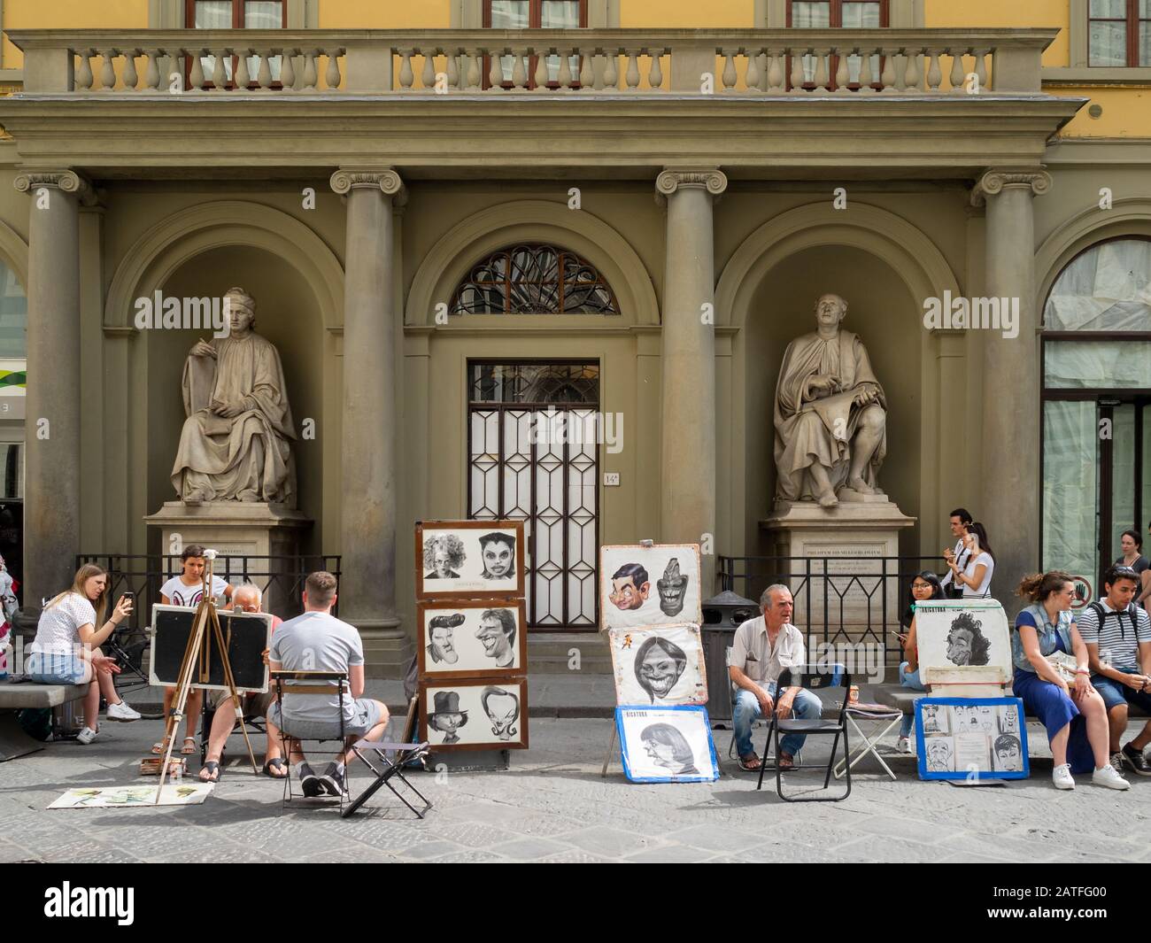 Street artists make cartoon portraits of tourists in Florence Stock ...