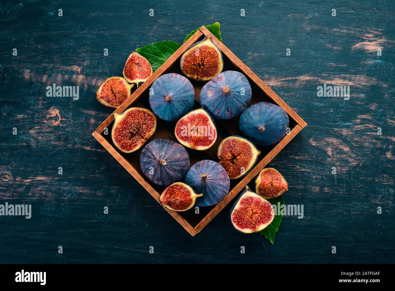 Fig. Fresh fruit figs in a wooden box. Free space for text. Top view ...