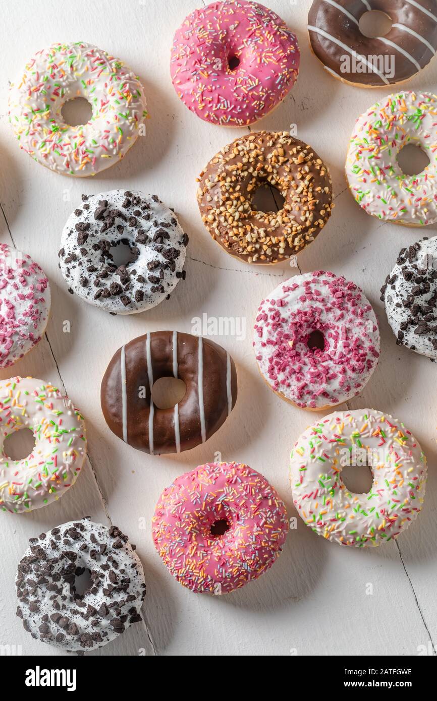 Top view of donuts with various types of toppings Stock Photo - Alamy
