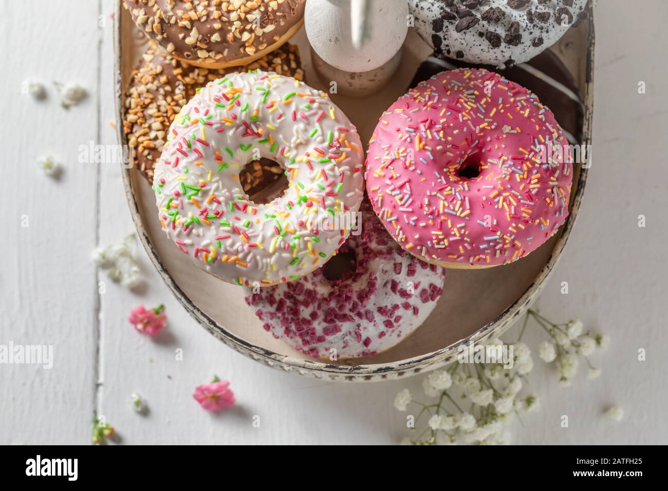 Top down view of tasty donuts with colorful decorations Stock Photo - Alamy