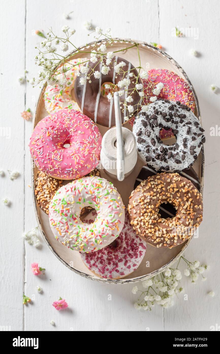 Top down view of colorful donuts with tasty decorations Stock Photo - Alamy