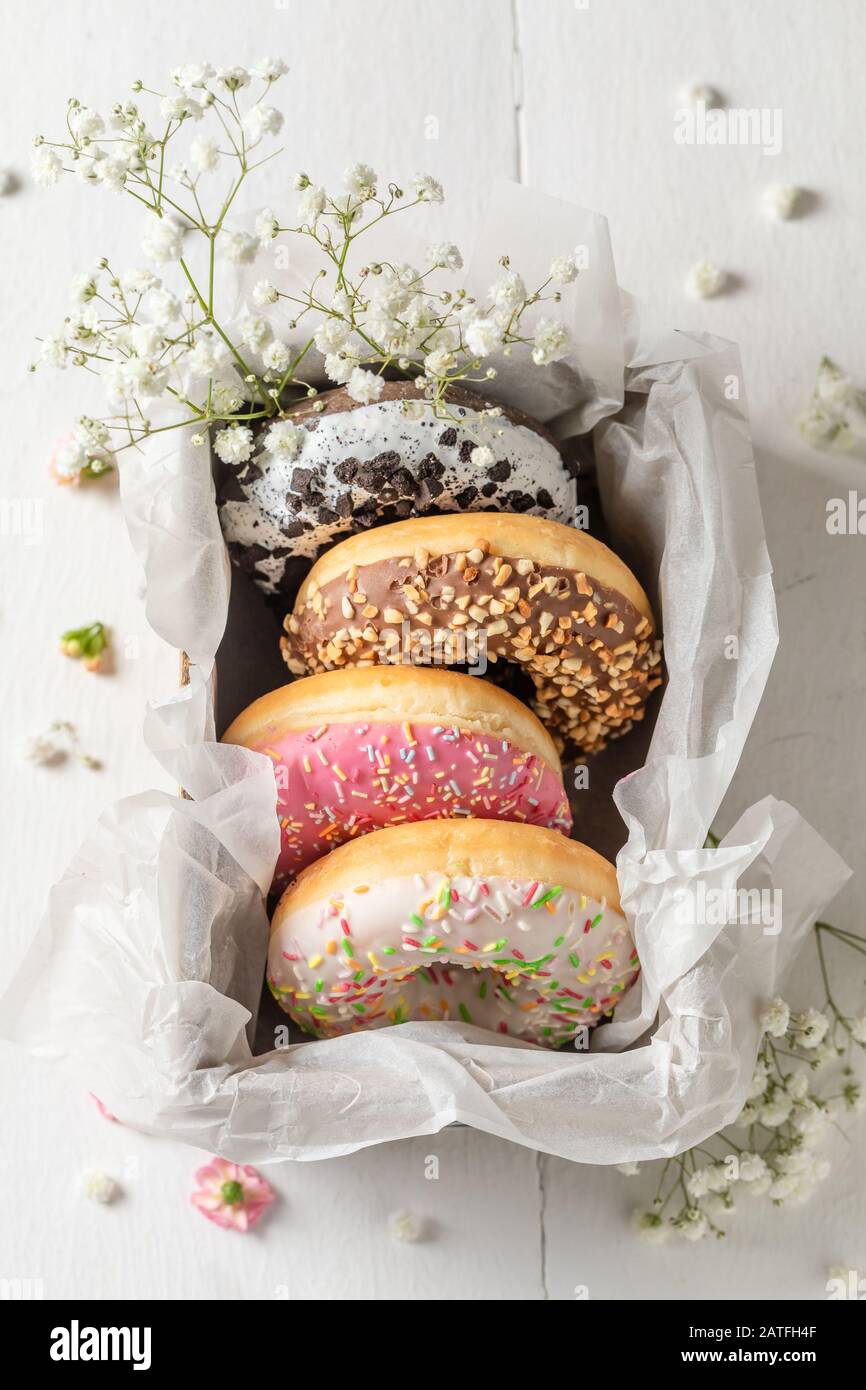 Top down view of colorful donuts with sweet toppings Stock Photo - Alamy