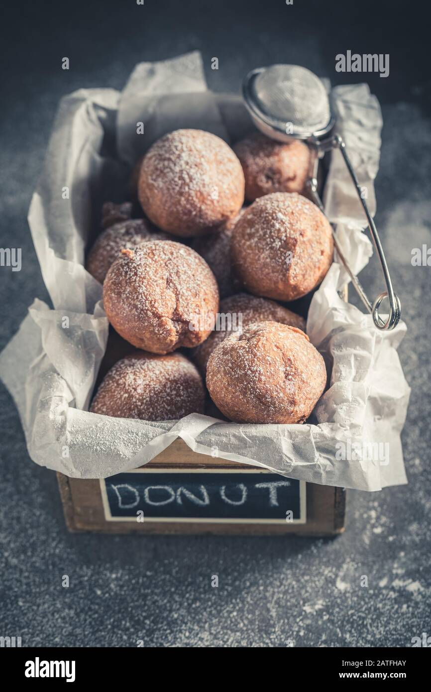 Sweet mini doughnuts with powdered sugar Stock Photo - Alamy