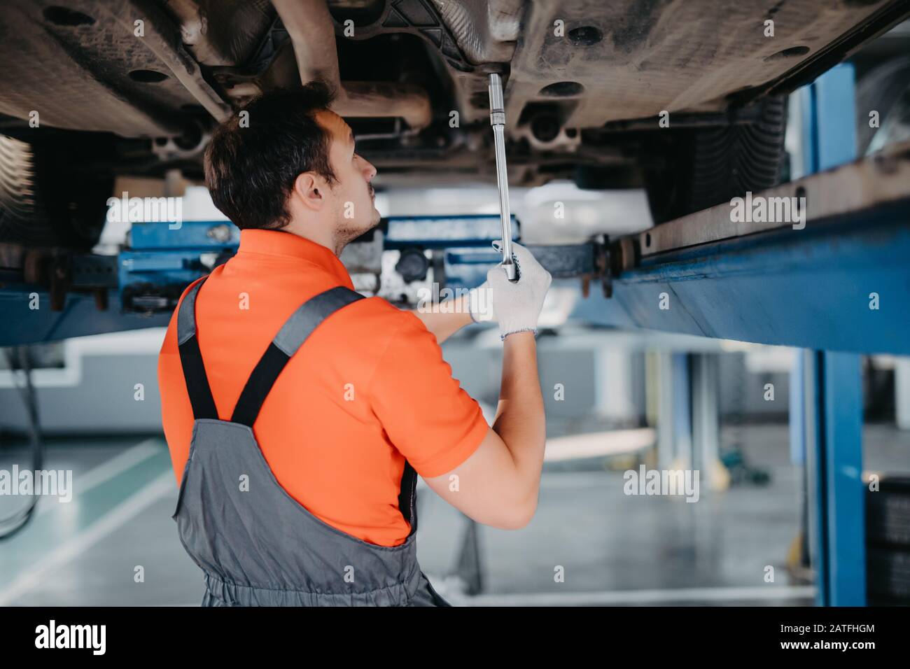 Car service, repair maintenance. Professional car mechanic man working ...