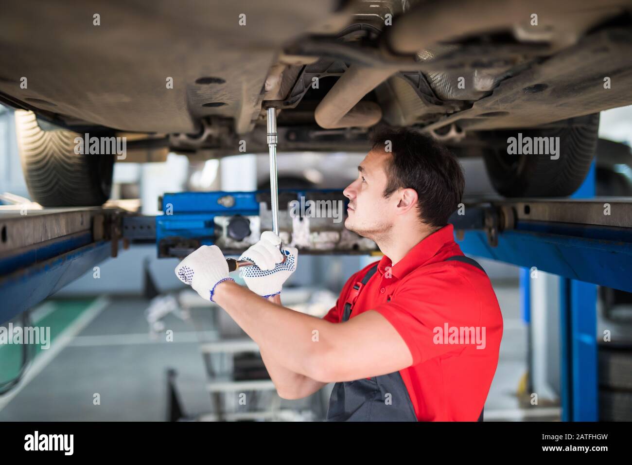Car service, repair maintenance. Professional car mechanic man working ...