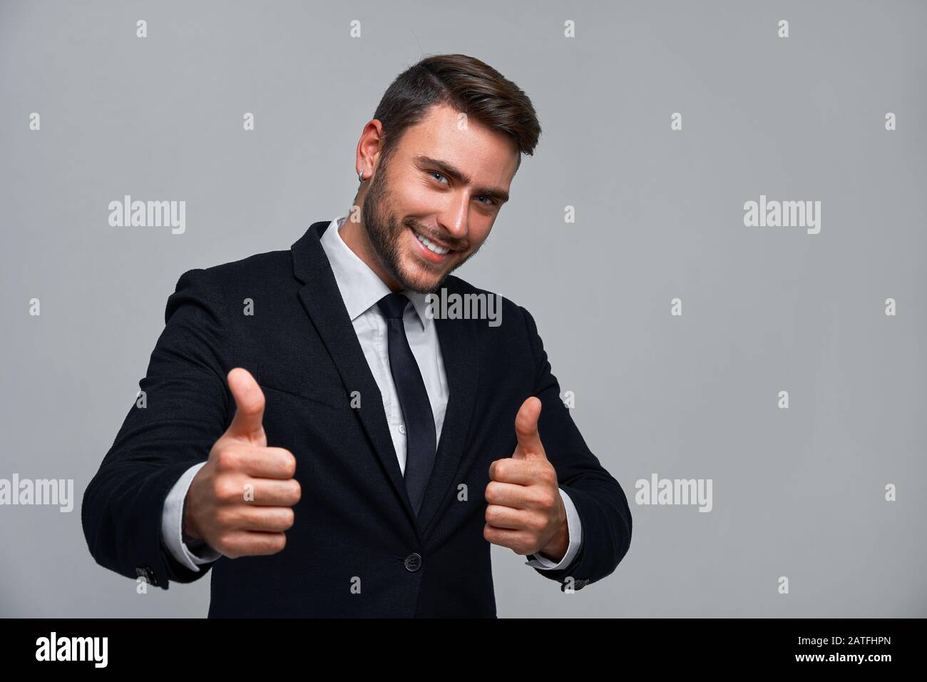 Portrait young smiling businessman. Caucasian guy business suit tie ...