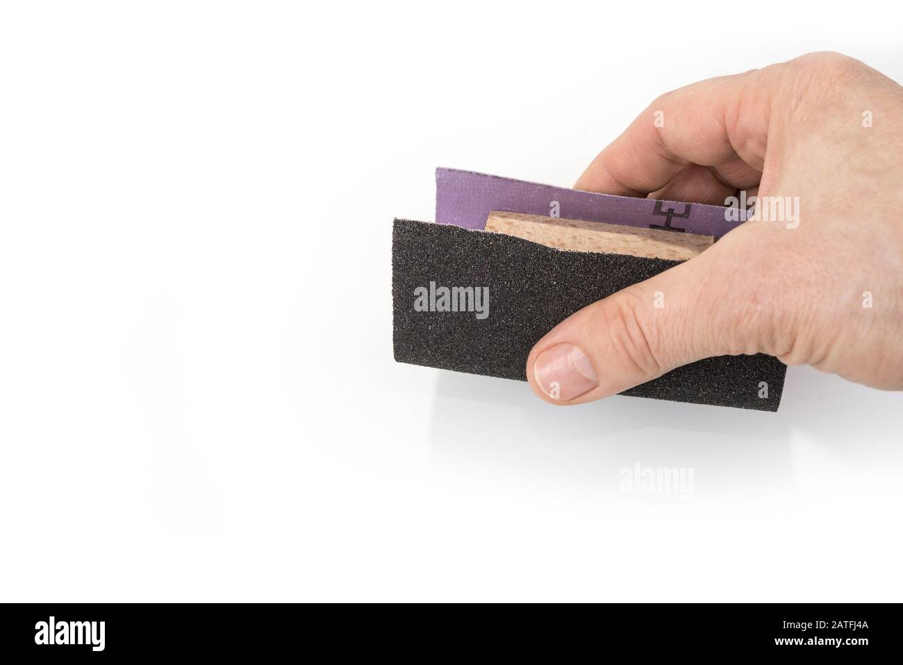 Hand holding sand paper with wood on white Stock Photo - Alamy