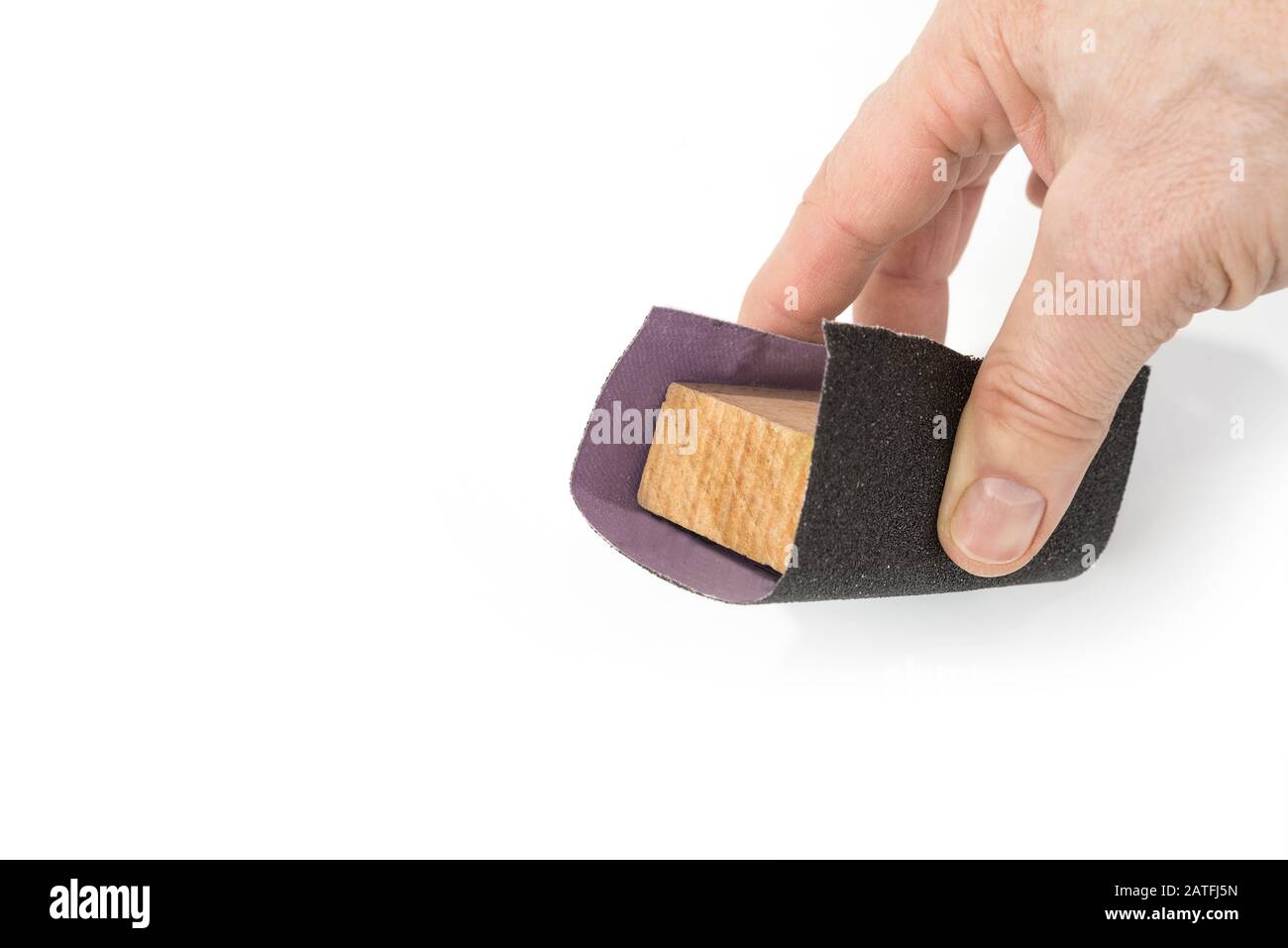 Hand holding sand paper with wood on white Stock Photo - Alamy