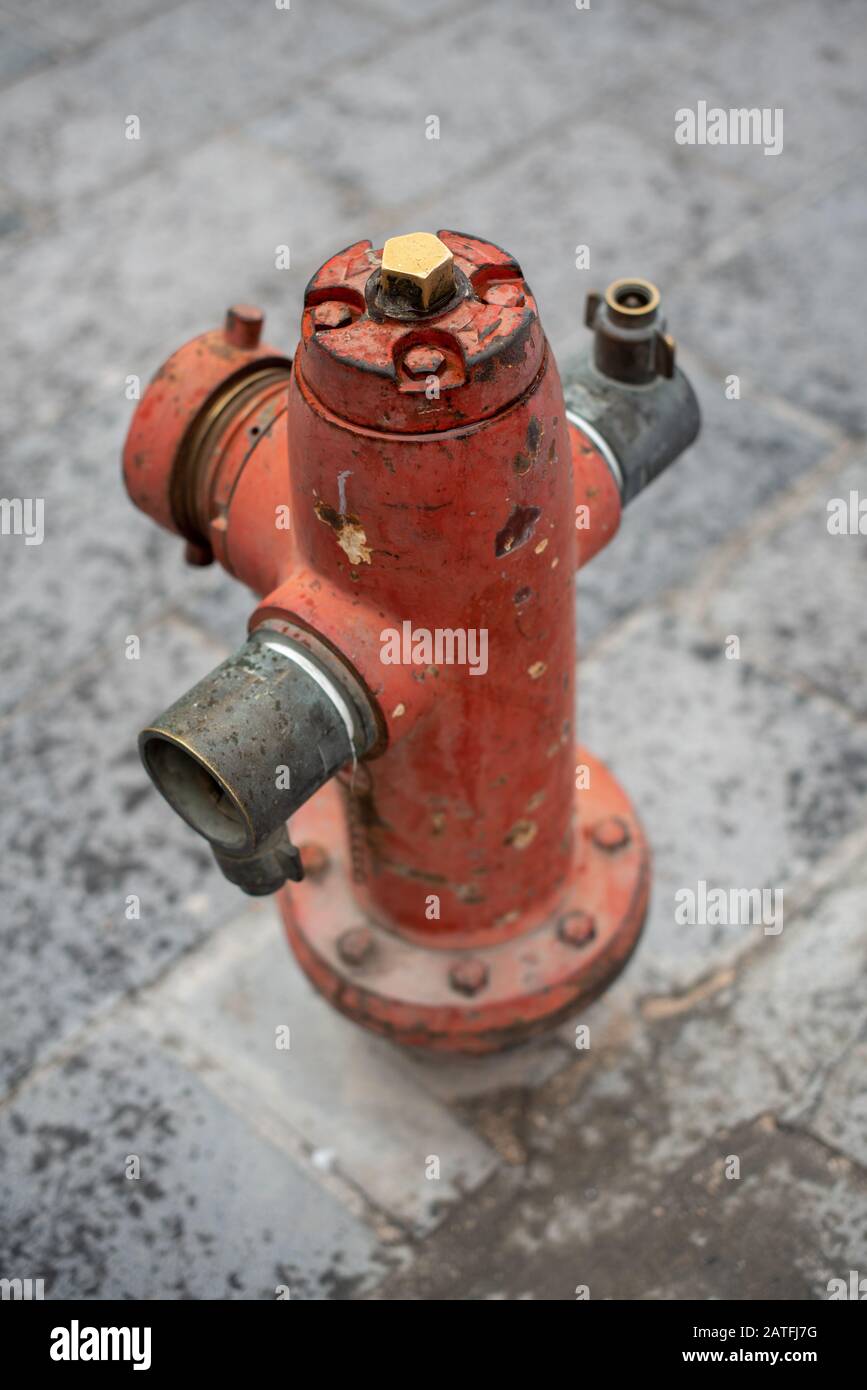 Top view of a vintage street fire hydrant seen on an isolated path in ...