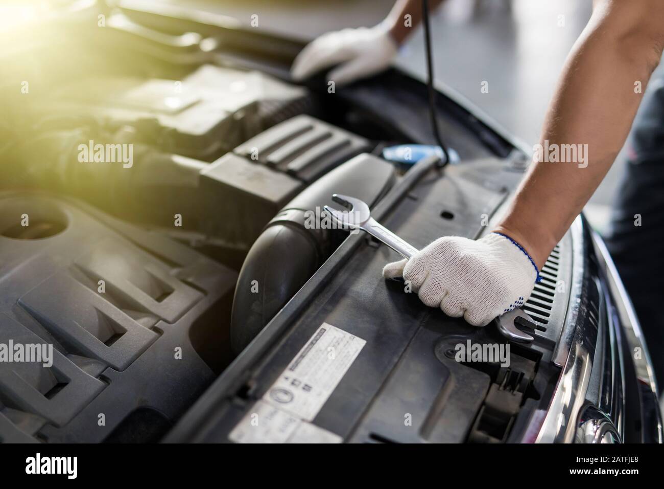 Mechanic working on a car engine Stock Photo - Alamy