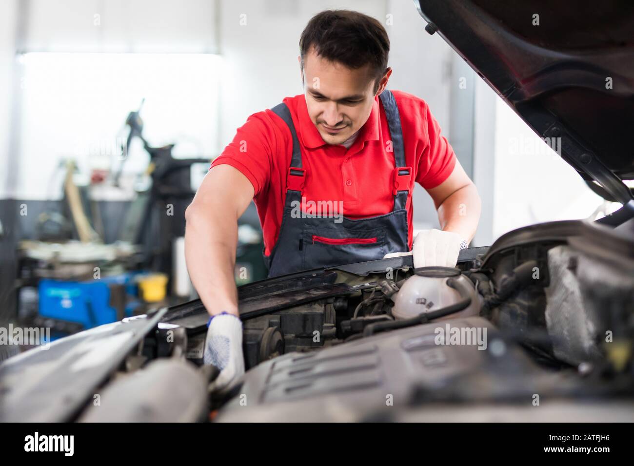 Hands of car mechanic working in auto repair service Stock Photo - Alamy