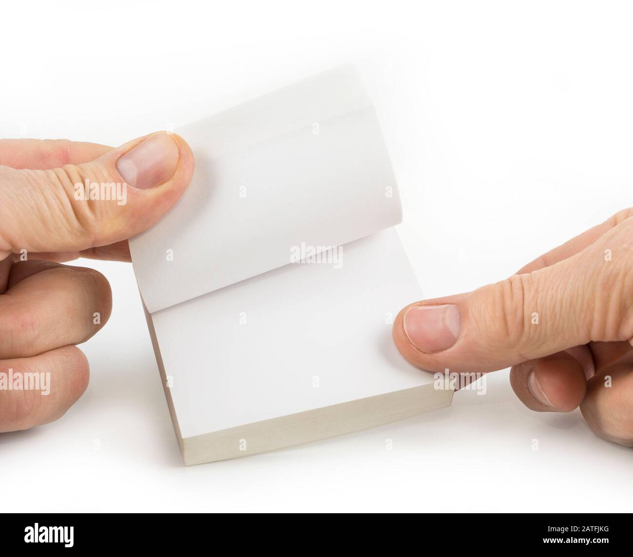 Block of paper notes hold with fingers Stock Photo - Alamy