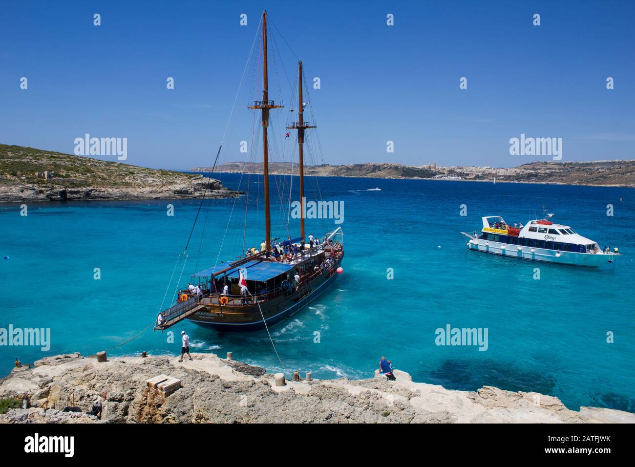 Tourist ship in Blue lagoon, Malta, on blue mediterranean waters Stock ...