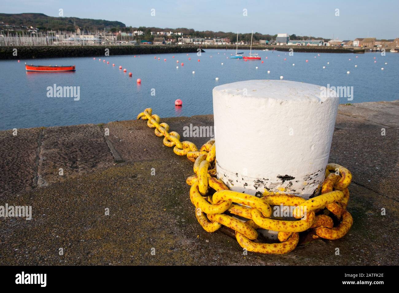 yellow metal industrial chain in port sea Stock Photo - Alamy