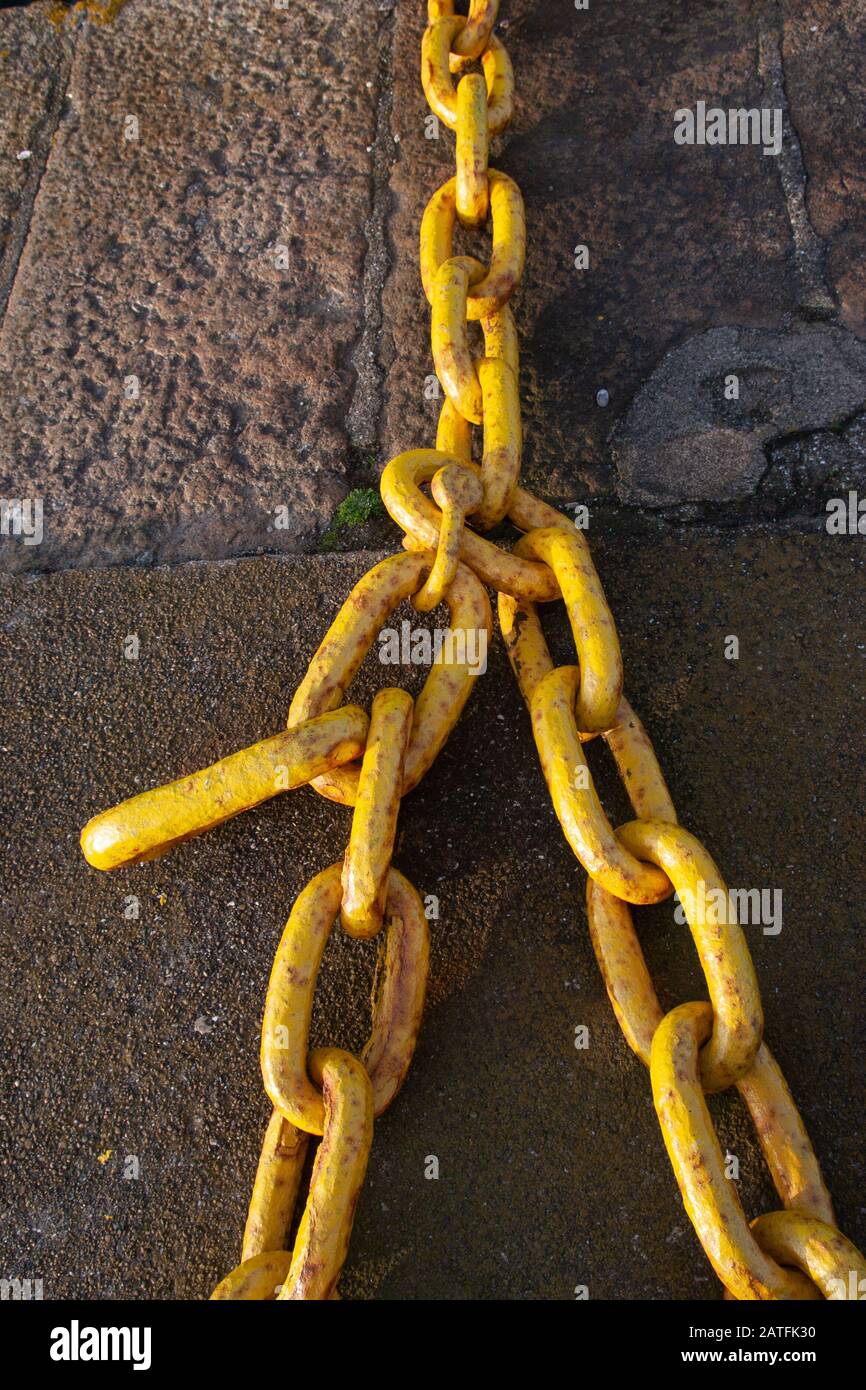 yellow big metal industrial chain in sea port Stock Photo - Alamy