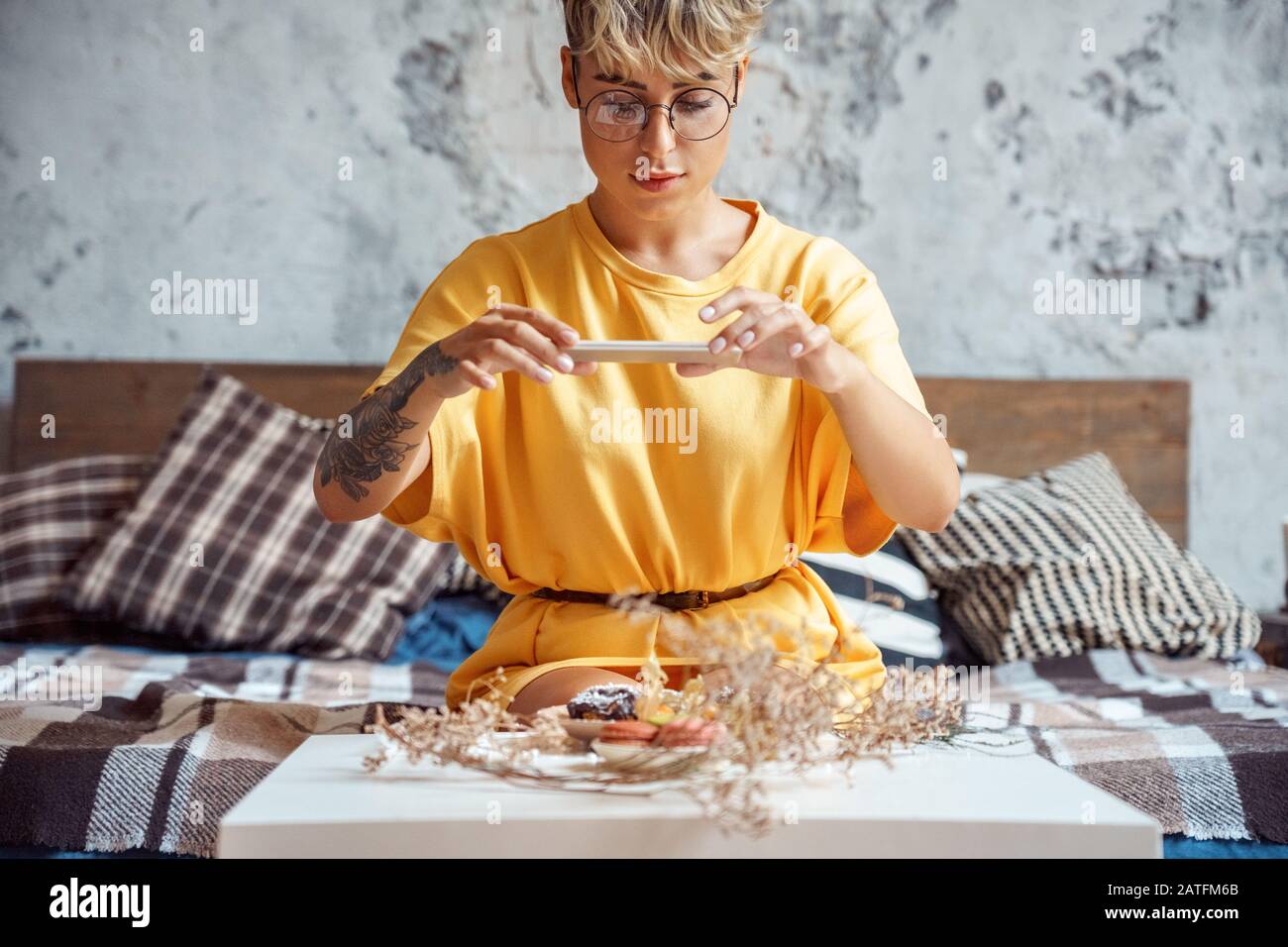 Young adult woman making food photo on modern smartphone Stock Photo ...