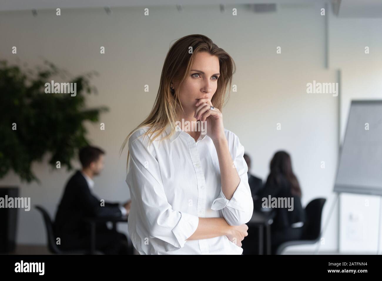 Sad woman thinking difficult choice hi-res stock photography and images ...