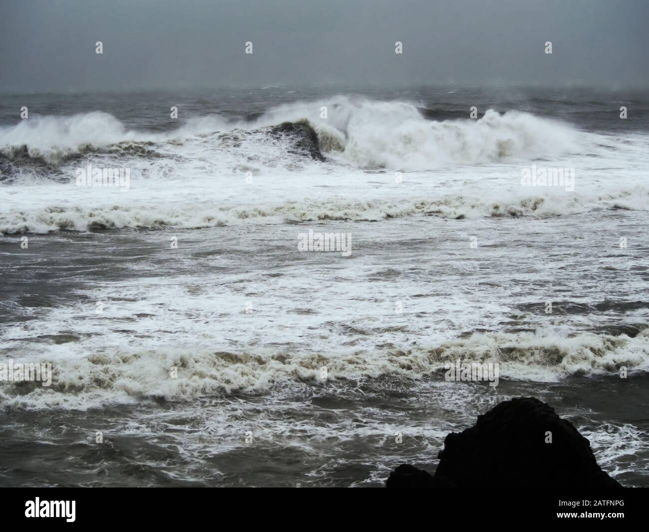 Sea storm with splash from big waves over cliffs. Gloria storm on the ...