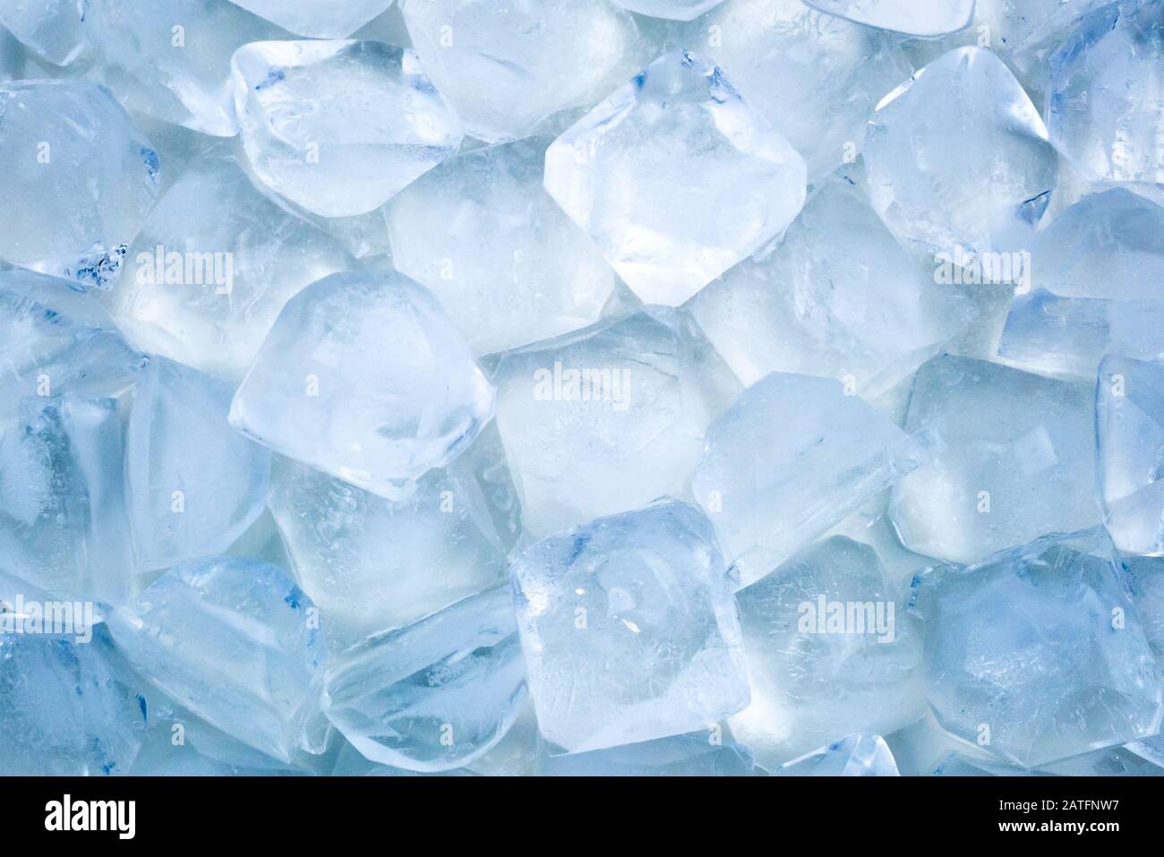 Ice cubes background texture with soft blue glowing Stock Photo - Alamy